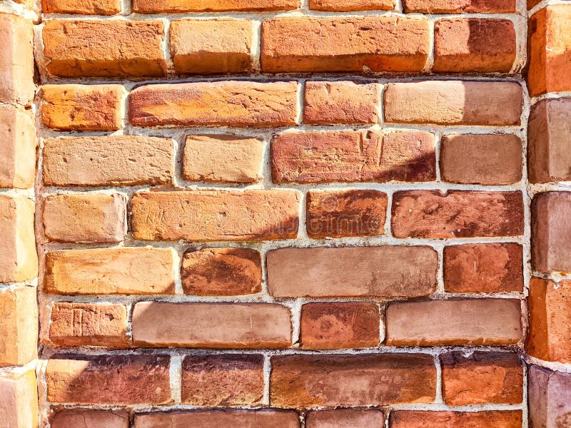 Rustic Red Bricks Form a Textured Wall, Displaying Color Variations and ...