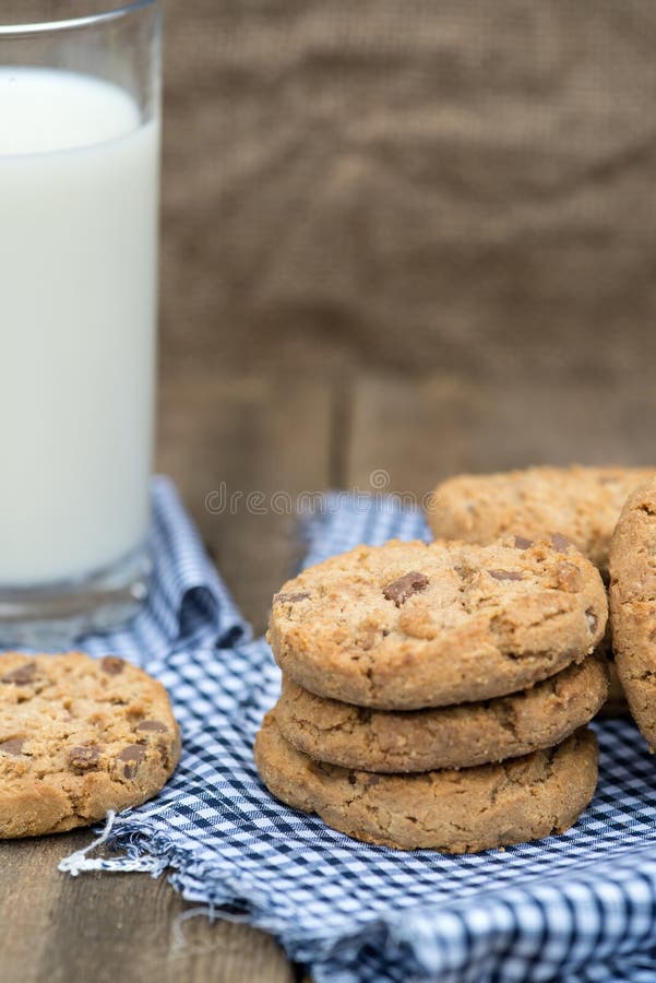 Rustic Setting with Chocolate Chip Cookies and Glass of Milk Stock ...