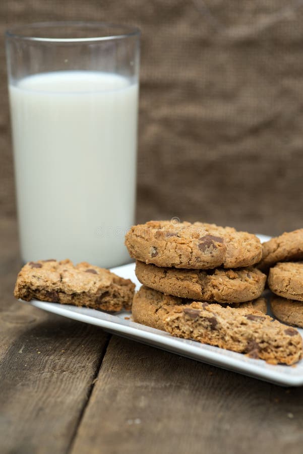 Rustic Setting with Chocolate Chip Cookies and Glass of Milk Stock ...