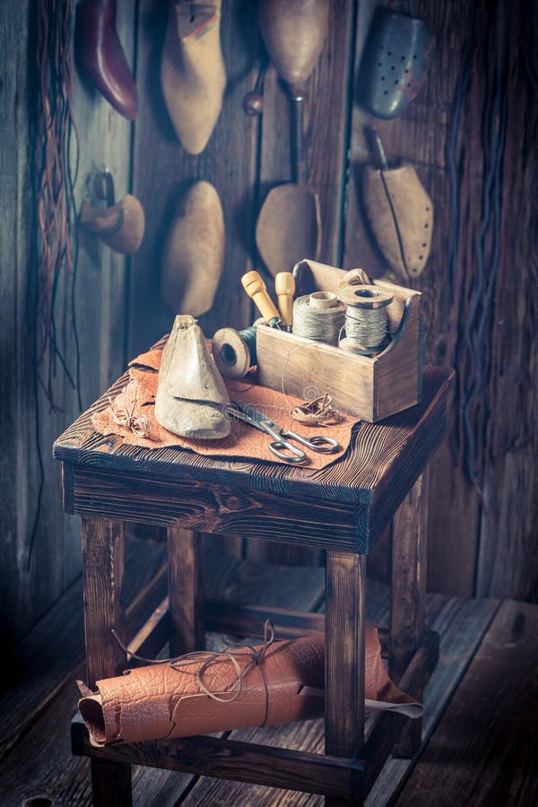 Rustic Shoemaker Workplace with Shoes, Laces and Tools Stock Image ...