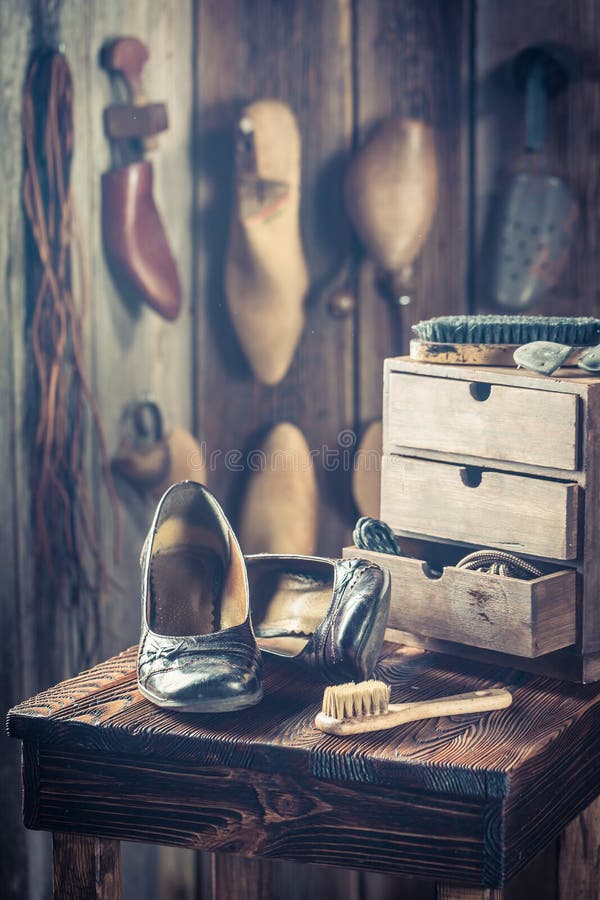 Rustic Shoemaker Workshop with Shoes and Brush Stock Photo - Image of ...