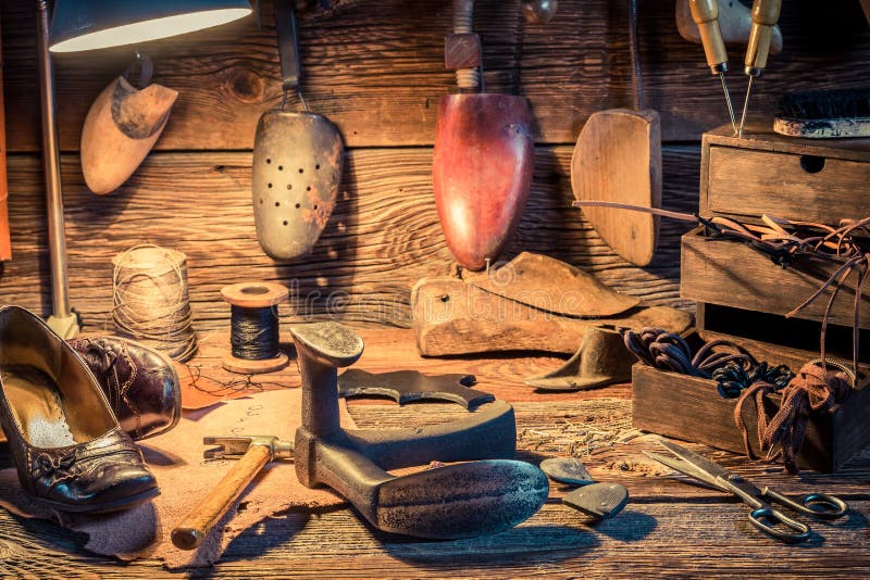 Rustic Shoemaker Workshop With Shoes And Laces Stock Image - Image of ...