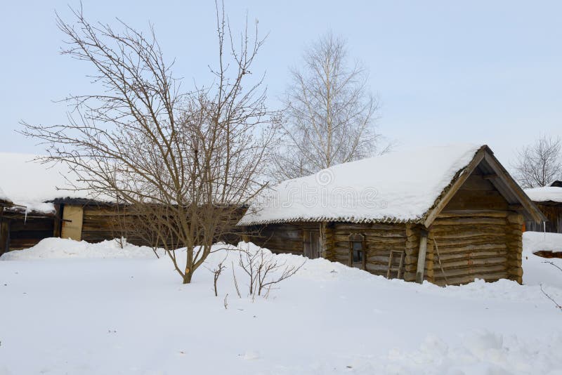 Rustic Snow-covered Courtyard with Log Buildings Stock Image - Image of ...