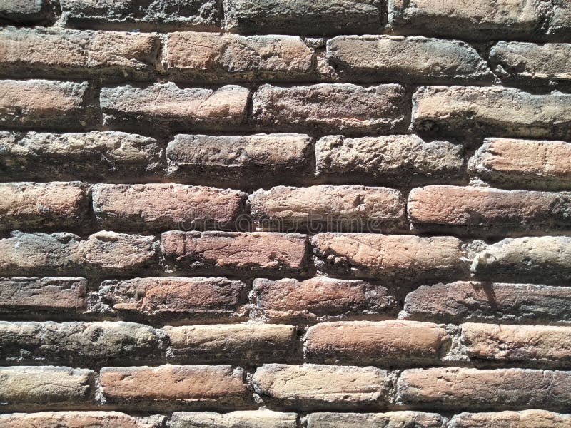 Solid Brick Wall with Variegated Red Color As a Background Stock Photo ...