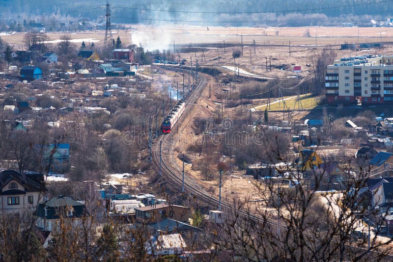 Rustic Spring View with a Train. Red Train Departs from the Village ...