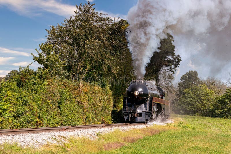 Rustic Steam Engine Train Chugging Along a Country Track, Surrounded by ...