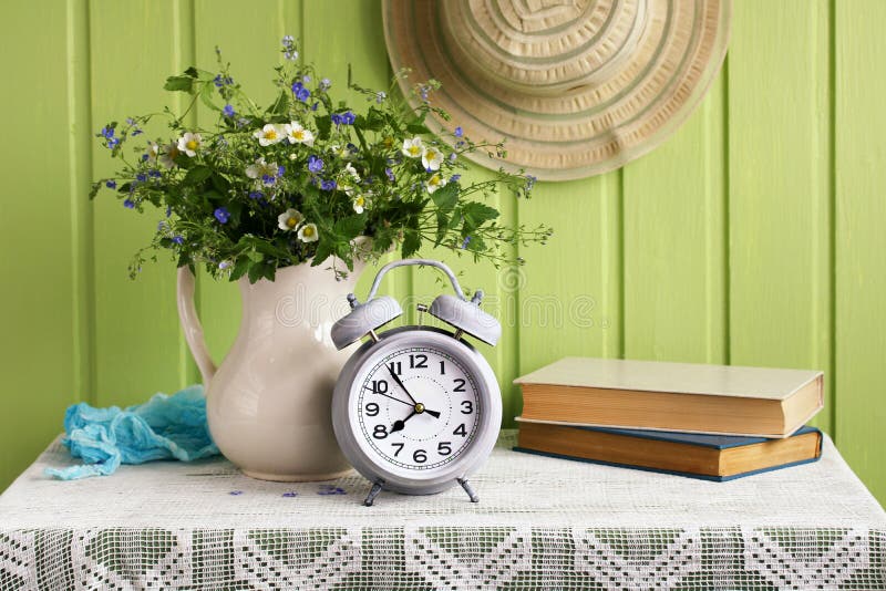Rustic Still Life with a Bouquet of Forest Flowers and an Alarm Clock ...