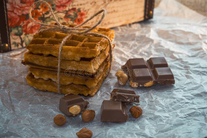 Rustic Still Life with Stacked Waffles and Chocolate with Hazelnuts ...