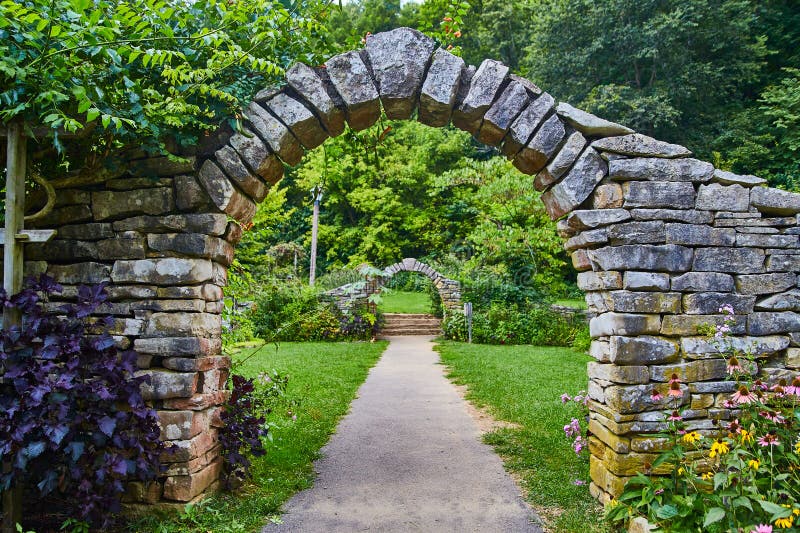 Rustic Stone Arches in Serene Garden Pathway Stock Image - Image of ...