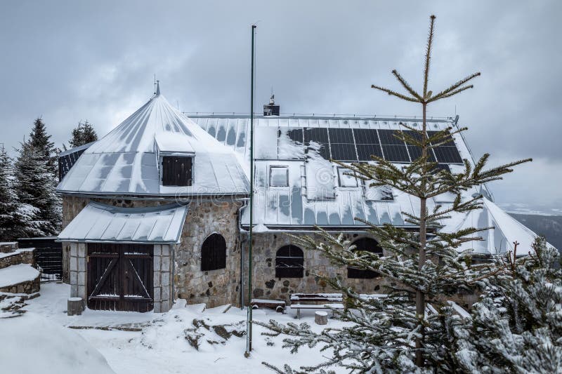 Rustic Stone Cabin with Solar Panels in Snowy Landscape. Stock Photo ...