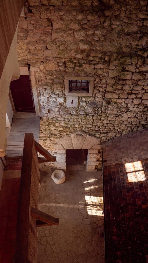 Rustic Stone Courtyard with Arched Doorway and Balcony Stock Photo ...