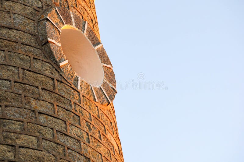 Rustic Stone Tower at Sunset with Clear Sky and Detailed Architecture ...