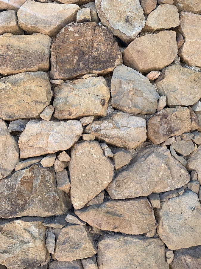 A Rustic Stone Wall. Captured in Marbella, Andalusia, Spain, this Scene ...