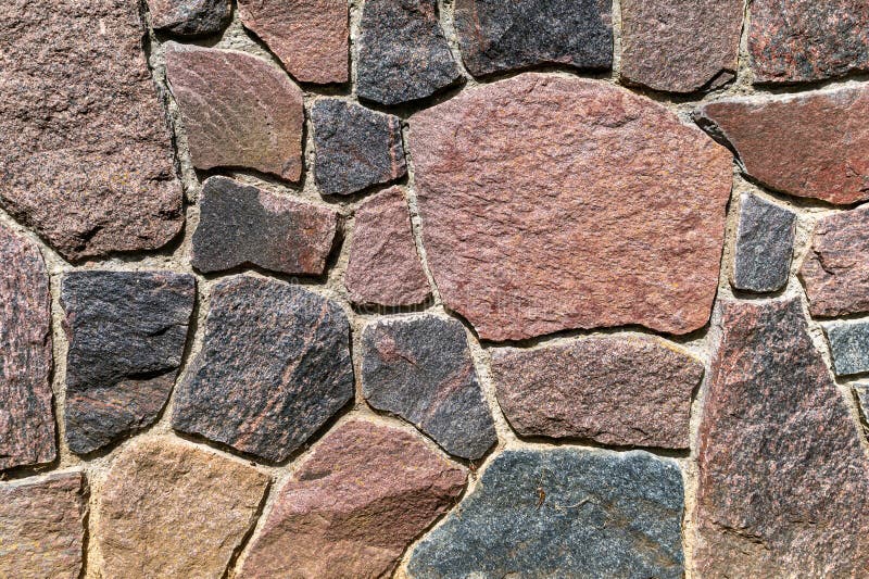 Close-up View of a Rustic Stone Wall Showcasing Various Textured Stones ...
