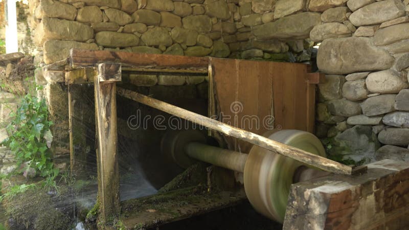 Rustic Stone Water Mill Wheel in Motion, Powered by Running Water Stock ...