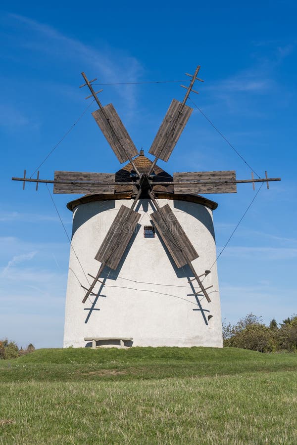 Rustic Stone Windmill in a Grassy Field Stock Photo - Image of stone ...