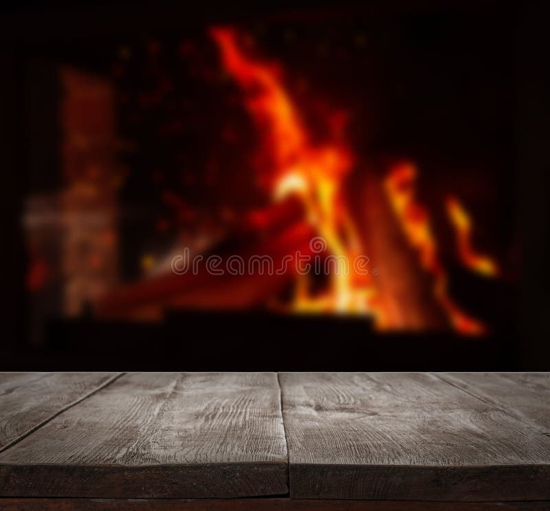 Rustic Table and Fireplace with Burning Wood Stock Photo - Image of ...