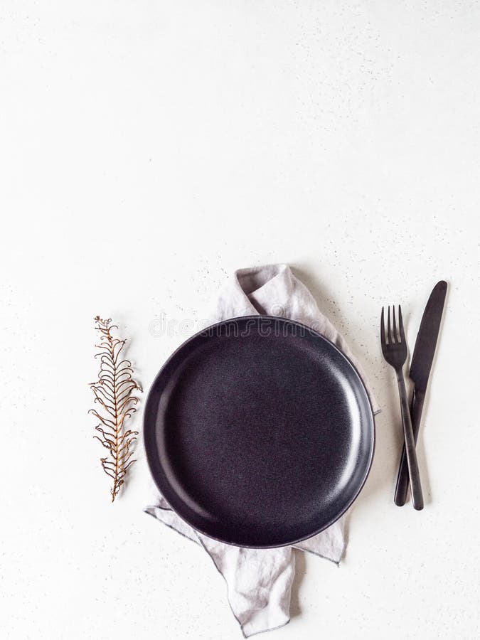 Rustic Table Setting with Black Plate, Napkin and Black Utensil on ...