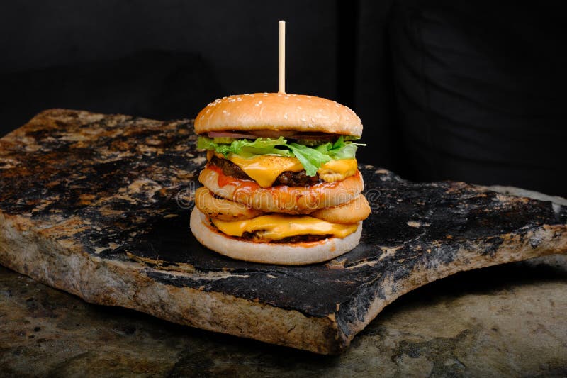 Rustic Tasty Burger on Stone Background Stock Photo - Image of takeout ...