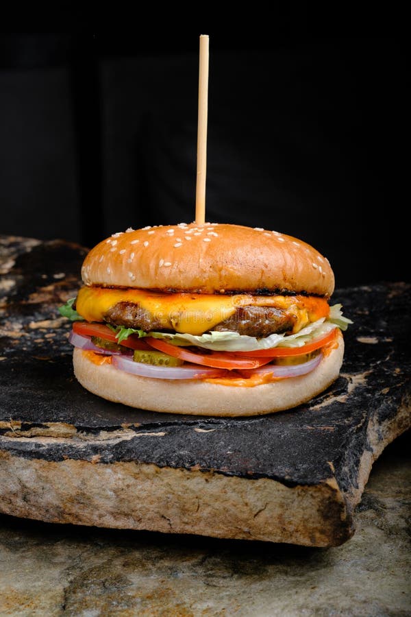 Rustic Tasty Burger on Stone Background Stock Photo - Image of grilled ...