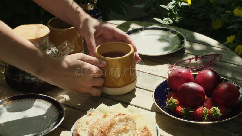 Drinking Tea and Having Morning Breakfast Outdoors. Stock Footage ...