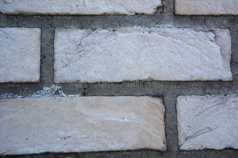 Rustic Texture of Beige Stone Bricks on a Weathered Wall Facade Stock ...