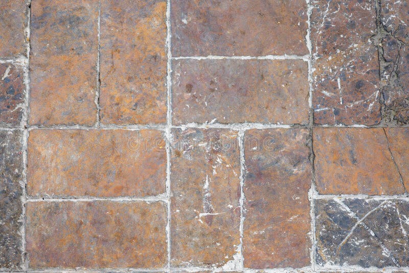Rustic Textured Stone Floor with Earthy Tones and Weathered Patterns ...