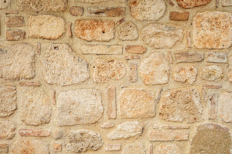 Rustic Textured Stone Wall with Natural Beige and Brown Tones Stock ...