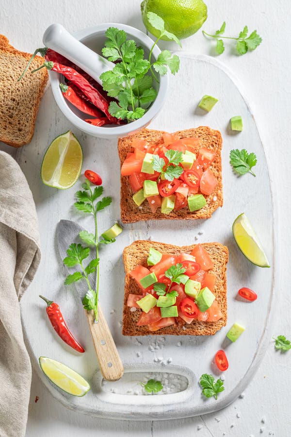 Rustic Toast with Tomatoes, Avocado and Coriander Stock Image - Image ...