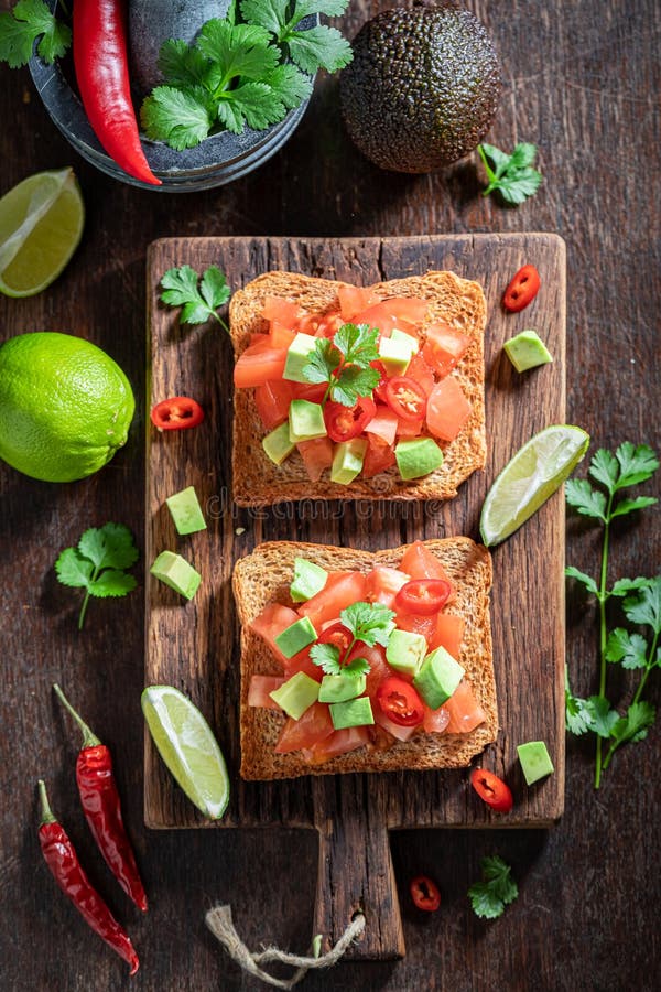 Rustic Toast with Tomatoes, Coriander and Lime Stock Image - Image of ...