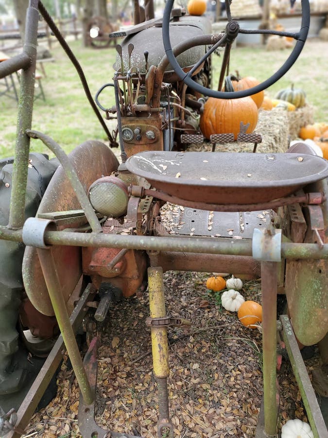 Rustic Tractor in Fall stock image. Image of machine - 200655183