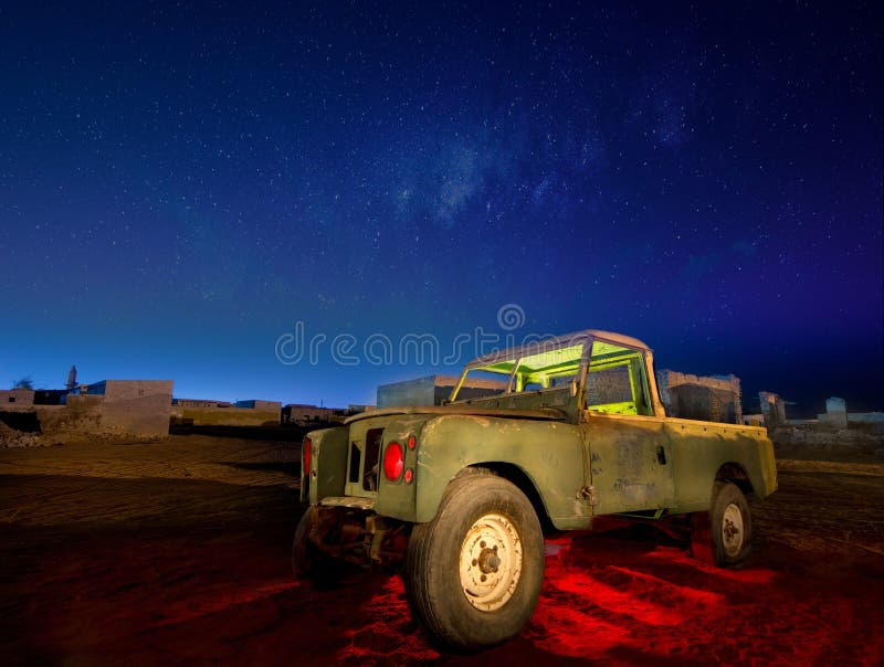 Rustic Truck Under a Starry Night Sky in a Desert Village. Stock Image ...