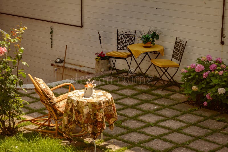 Rustic Two Sets of Tables and a Chairs in the Garden. Stock Image ...