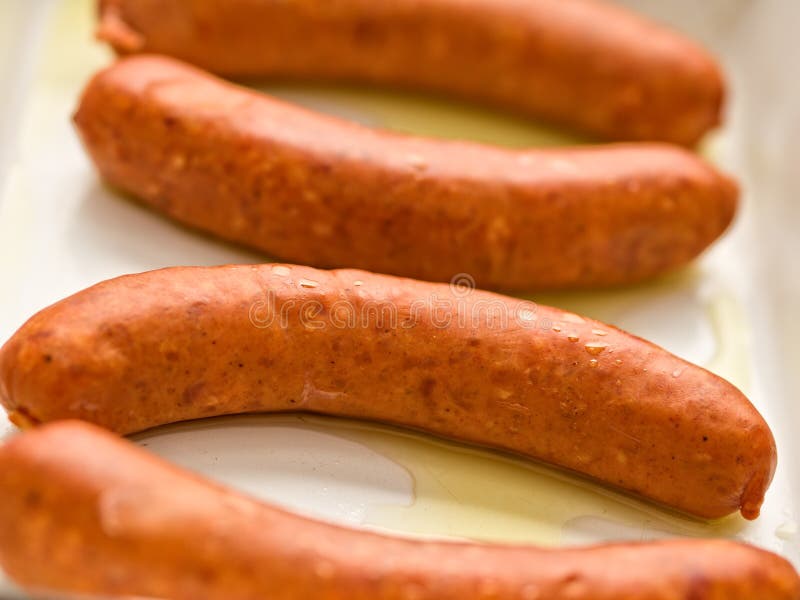 Rustic uncooked sausages stock photo. Image of cholesterol - 52190512