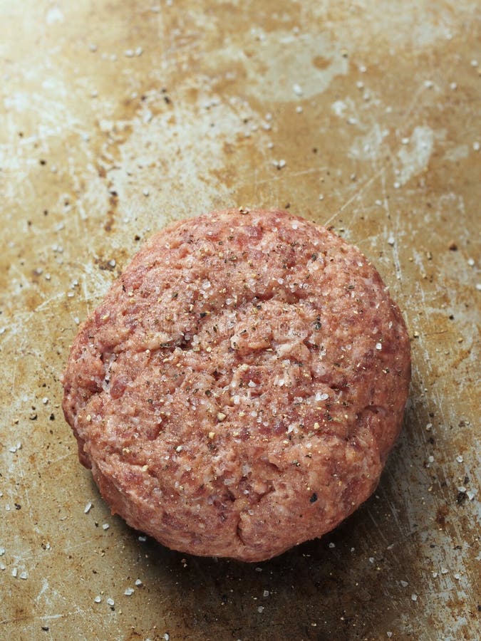 Rustic Uncooked Seasoned Hamburger Patty Stock Photo - Image of barbie ...