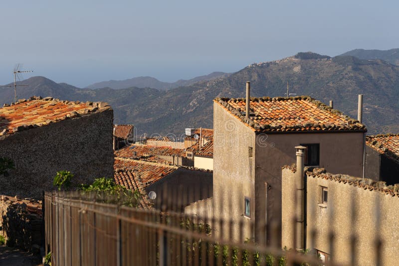 Rustic Village Rooftops with Mountain and Coastal Views Stock Image ...