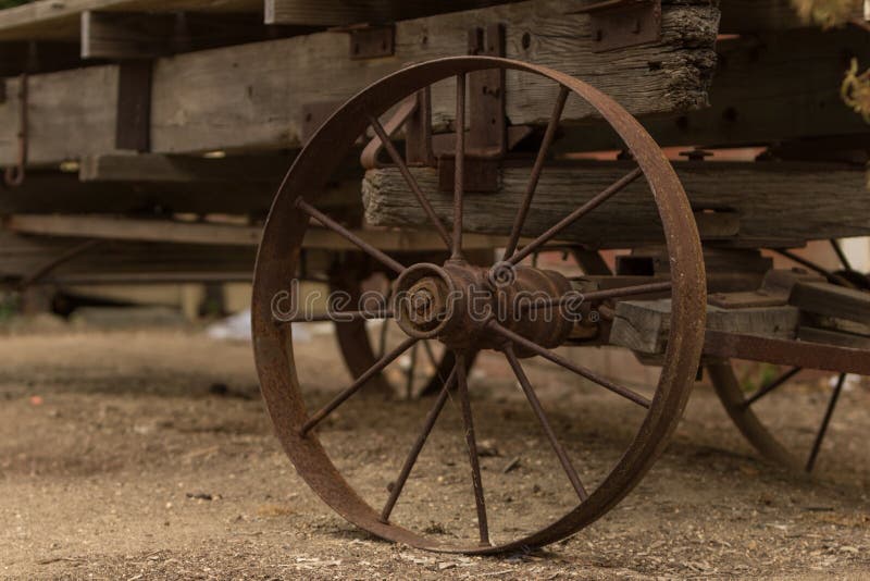 Rustic wagon wheel stock photo. Image of rusty, obsolete - 56047406