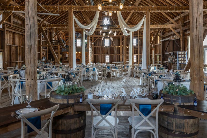 Rustic Wedding Reception Setup in a Beautifully Decorated Barn with ...