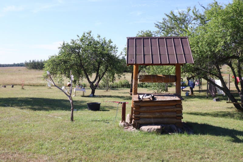 Rustic Well in a Rural Landscape Surrounded by Greenery Editorial Photo ...