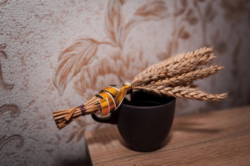 Rustic Wheat Bundle in Black Mug on Wooden Surface Stock Image - Image ...