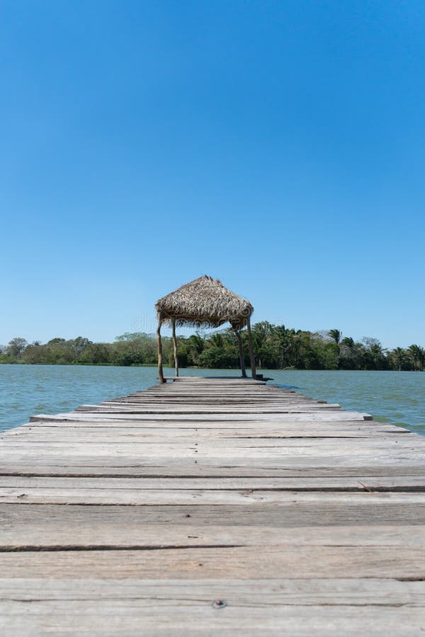 Rustic wood pier on river stock photo. Image of wood - 177174808