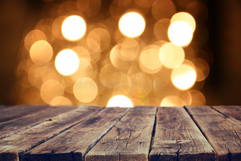 Rustic Wood Table in Front of Glitter Gold Bright Bokeh Lights Stock ...