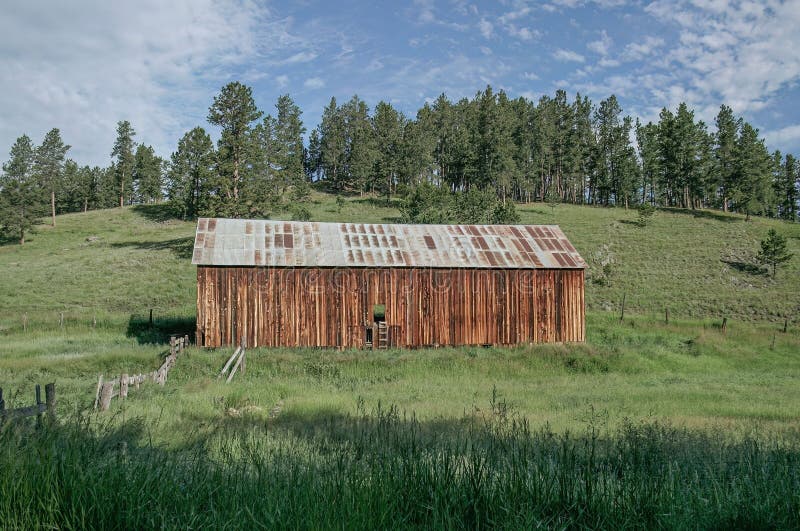Rustic Wooden Barn Set in Lush Green Fields. Stock Photo - Image of ...