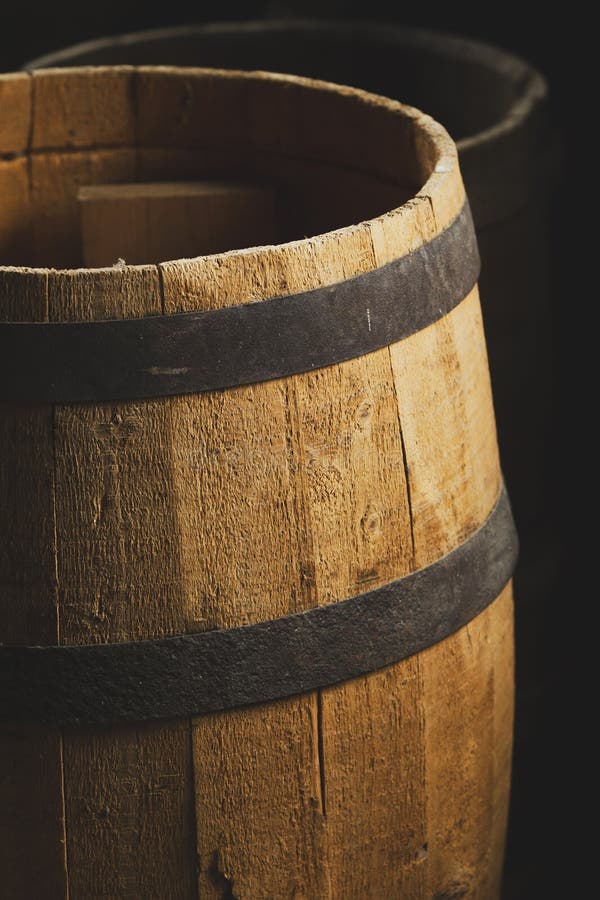 Rustic Wooden Barrel with Aged Metal Bands in Low Light Stock Photo ...