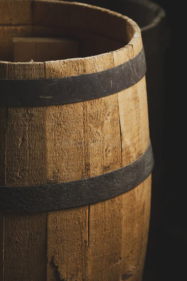 Rustic Wooden Barrel with Aged Metal Bands in Low Light Stock Photo ...