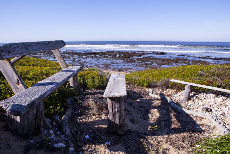 A Rustic Wooden Bench on the Beach Stock Photo - Image of benches ...