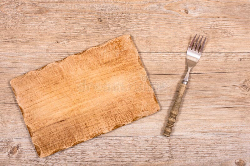 Rustic Wooden Board with a Fork Stock Image - Image of space, brown ...