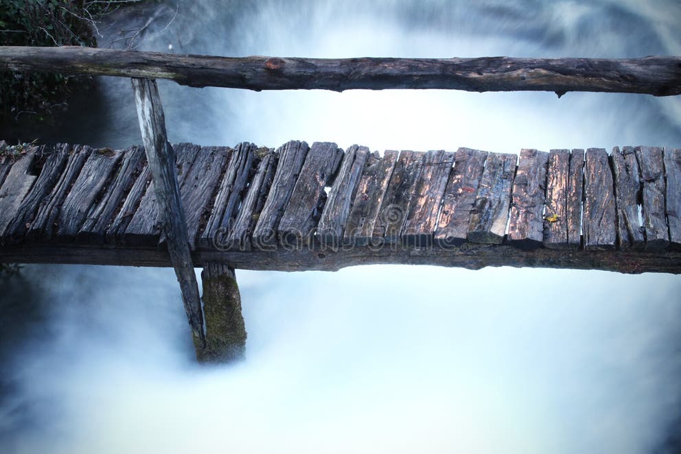 Rustic Wooden Bridge on the River Stock Photo - Image of rough, brook ...