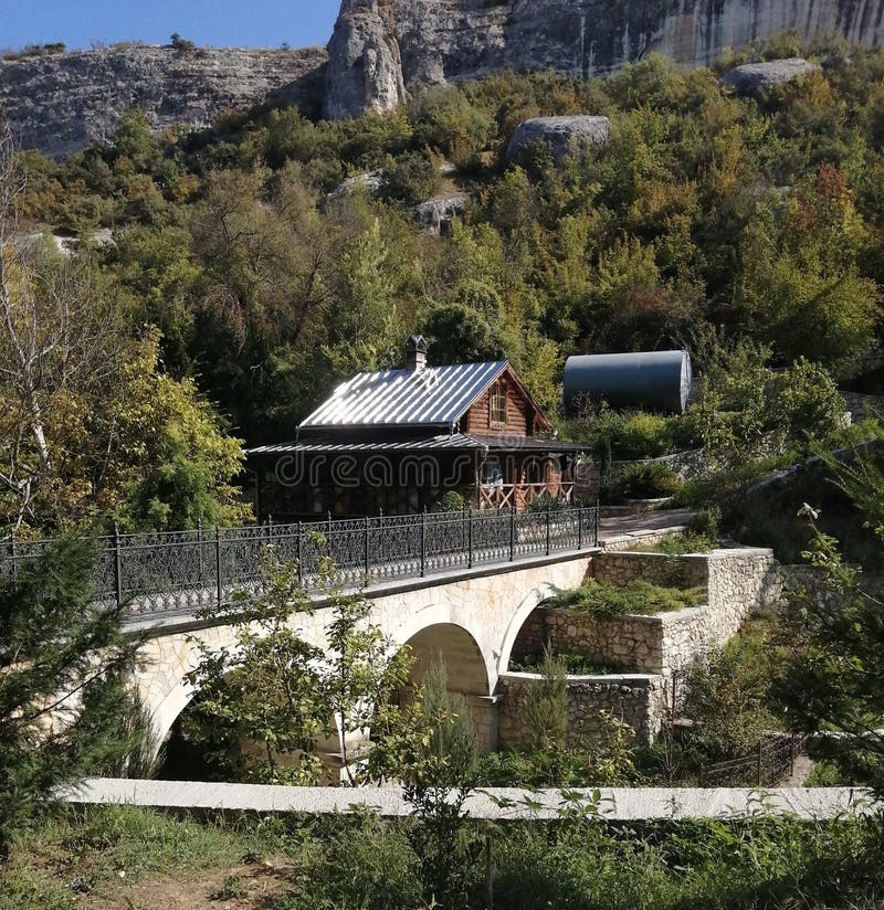 Rustic Wooden Cabin Romantically Perched on Historic Stone Bridge Stock ...