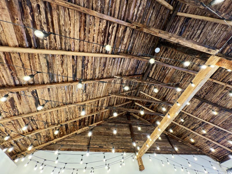 Rustic Wooden Ceiling Adorned with Warm String Lights during Nighttime ...